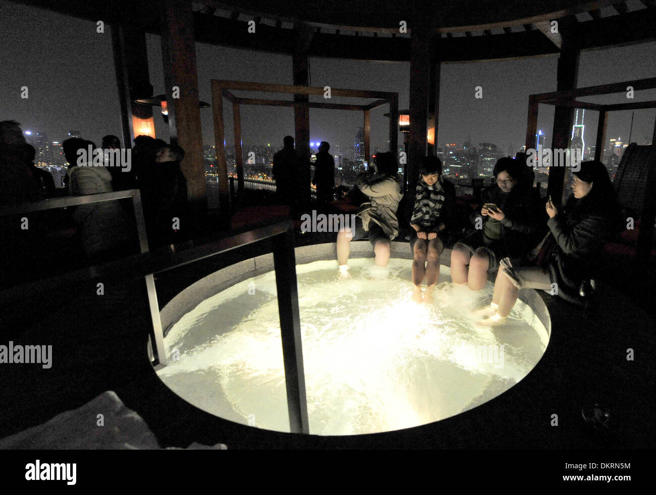 Shanghai, China. 18th Nov, 2013. Visitors sit at the whirl pool of a ...