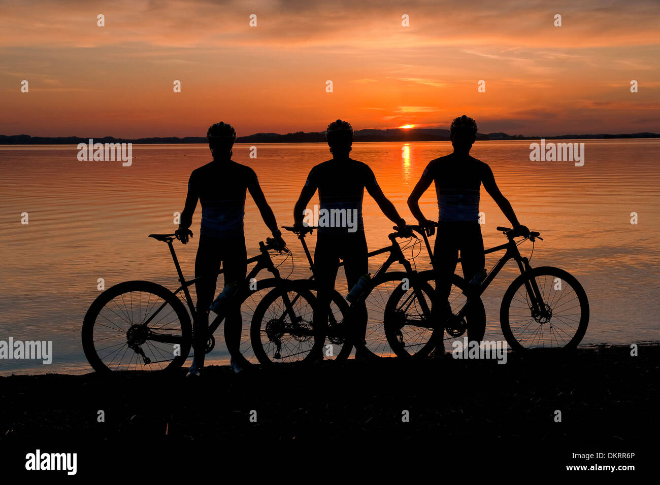 Sport wheel bicycle riding a bike biking cyclist mountain biker Chiemsee sundown sun mood ...