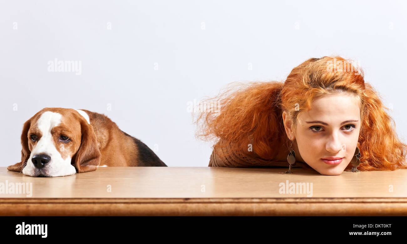 girl with red hair and cute beagle Stock Photo - Alamy