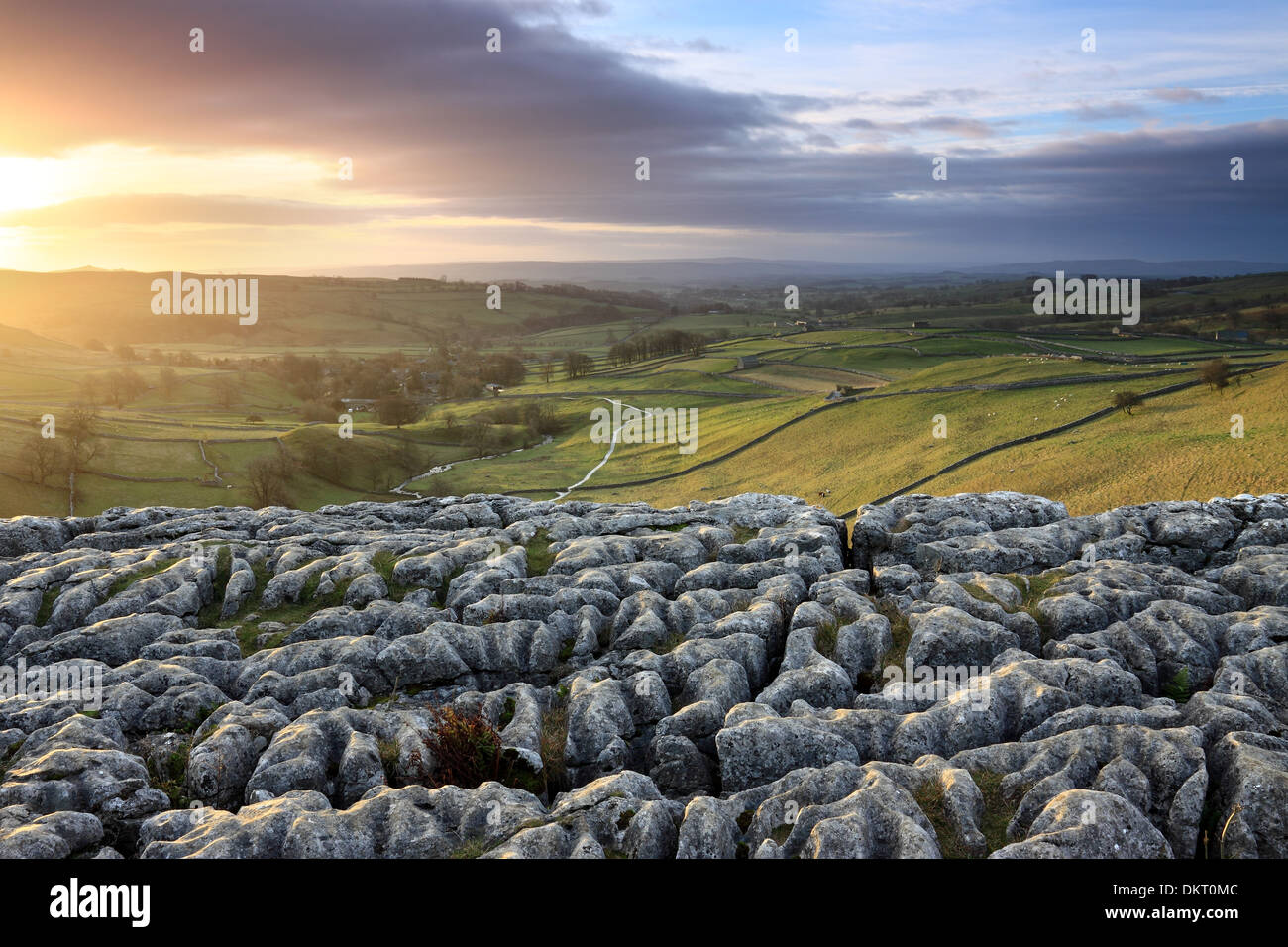 Sunrise over the weathered rocks of Malham Cove in the Yorkshire Dales ...