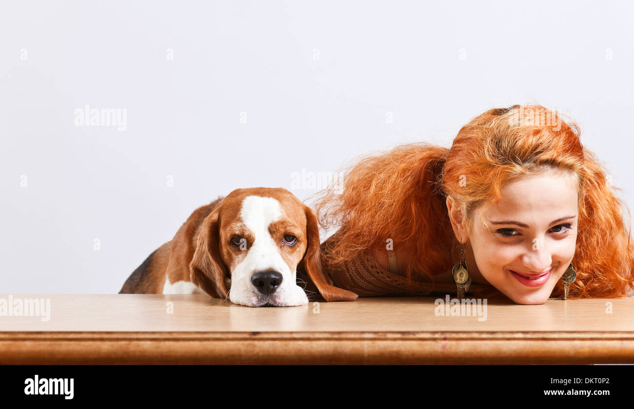 girl with red hair and cute beagle Stock Photo - Alamy
