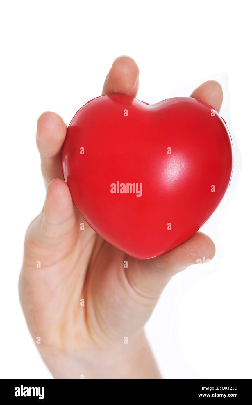 Red heart held on a female's hand. Isolated on white Stock Photo - Alamy