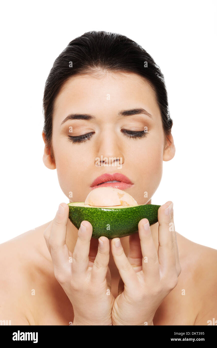 Beautiful woman's face with avocado. Isolated on white Stock Photo - Alamy