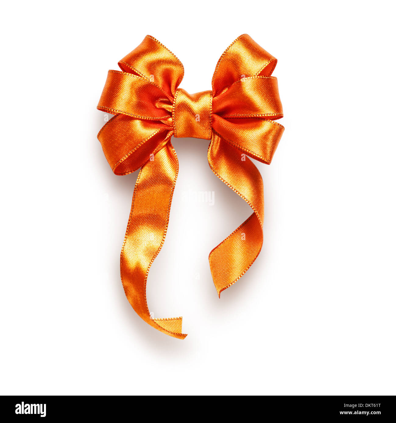 Orange ribbon bow isolated on white background clipping path included ...