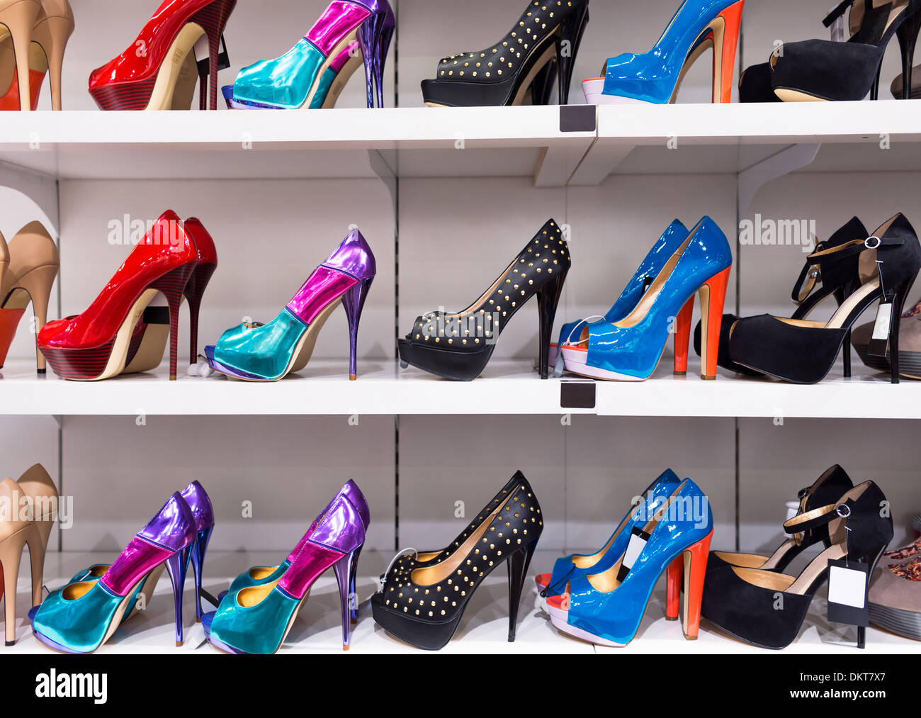 Background with shoes on shelves of shop Stock Photo - Alamy