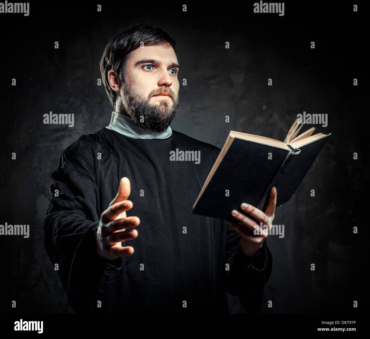 Priest with Prayer book Stock Photo - Alamy