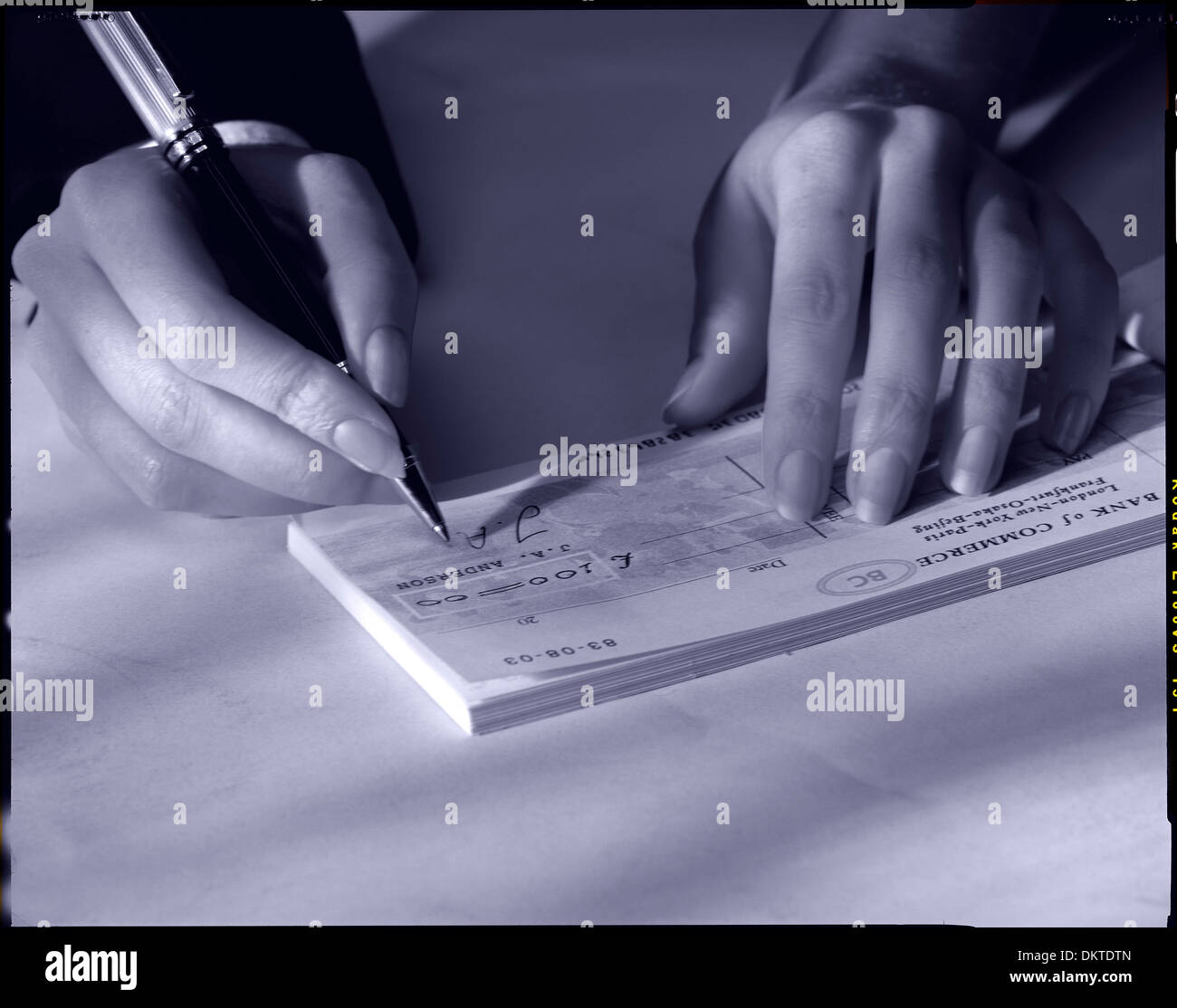 writing a cheque Stock Photo - Alamy