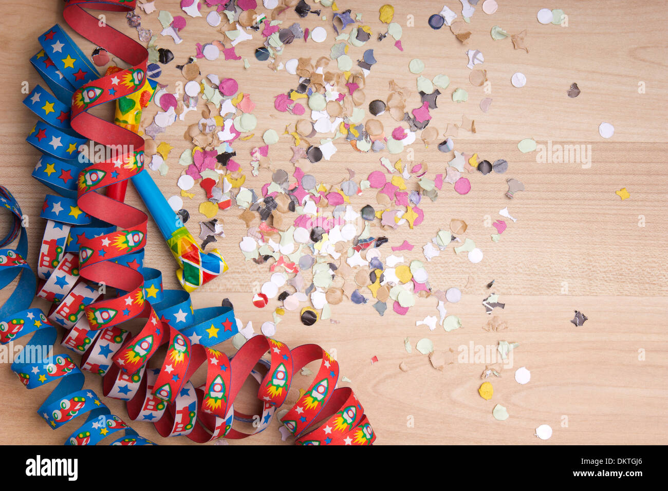 streamers and confetti as decoration for parties, sylvester with wooden ...