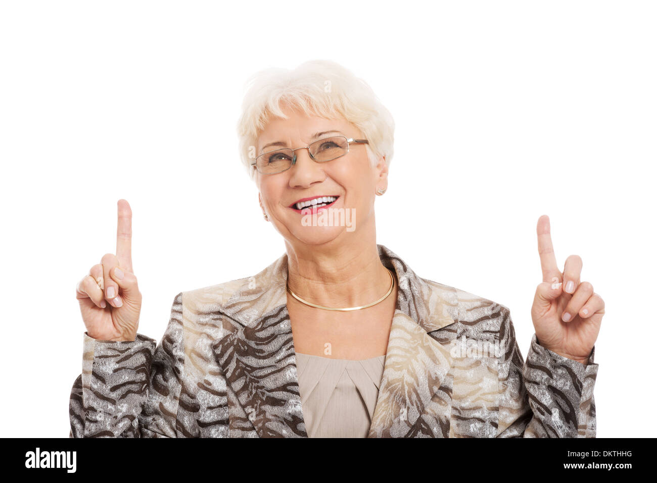 An old casual lady pointing up on copy space. Isolated on white Stock ...