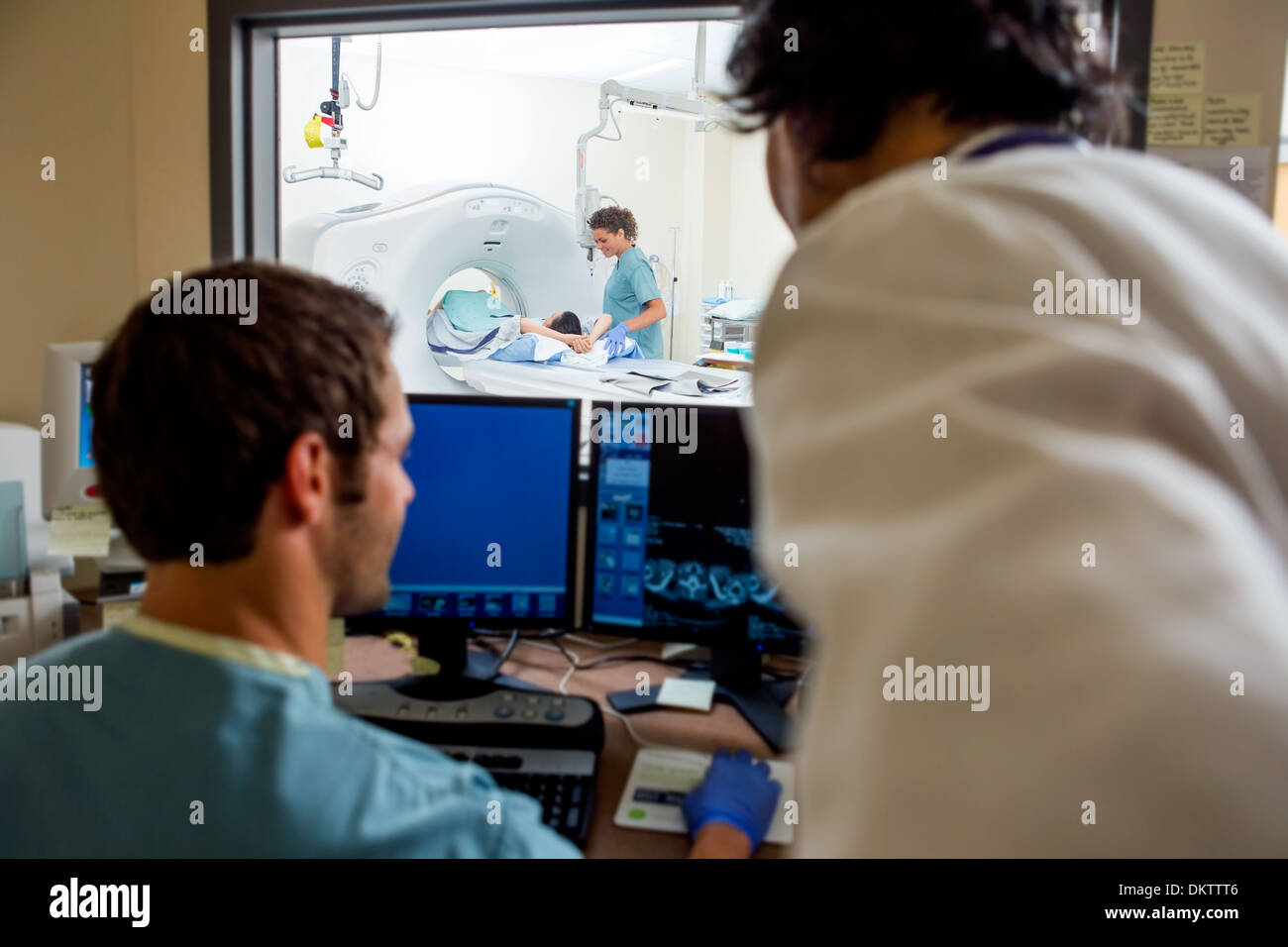 Medical Team Operating Computers In CT Scan Lab Stock Photo - Alamy