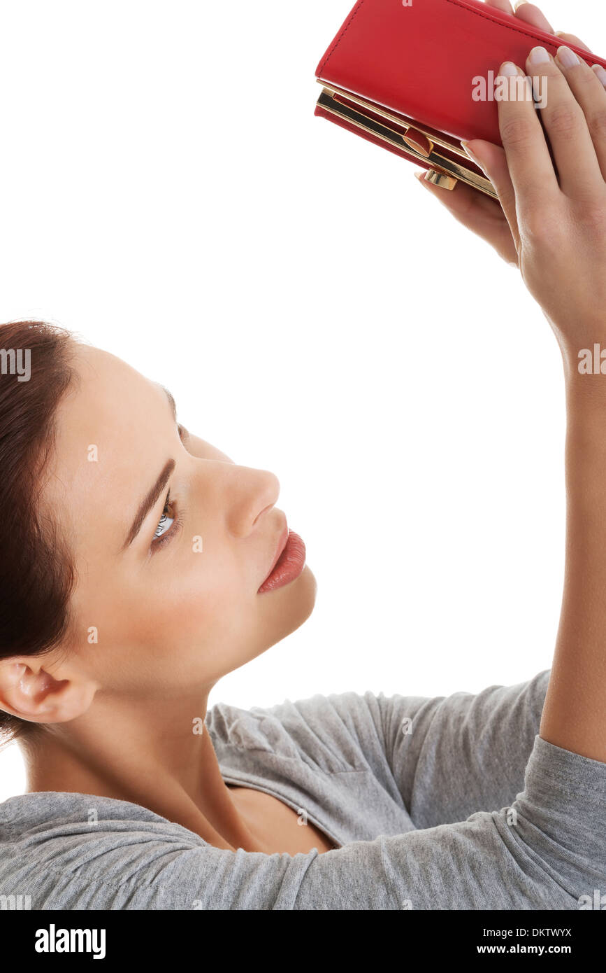 Beautiful young woma checking her empty wallet. Isolated on white Stock ...