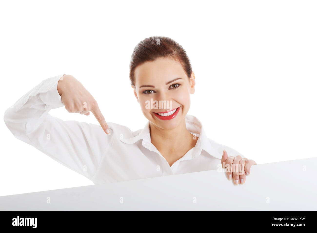 Beautiful business woman pointing on copy space. Isolated on white ...
