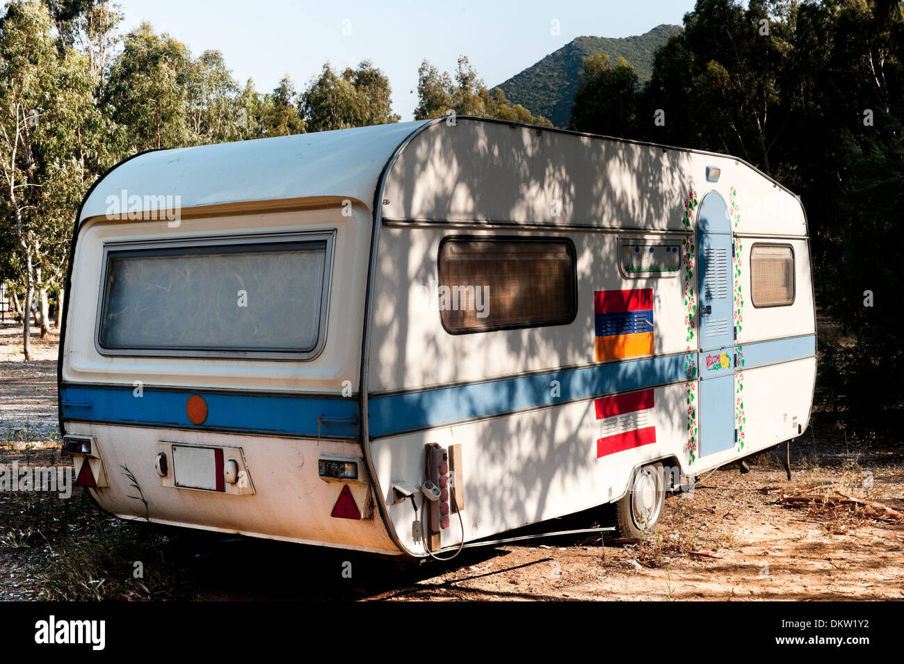 Old caravan parked in a campsite Stock Photo - Alamy