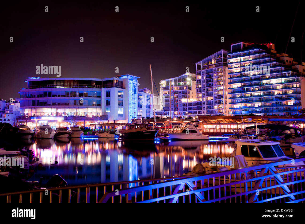 The famous marina in Gibraltar (Ocean Village) at night Stock Photo - Alamy