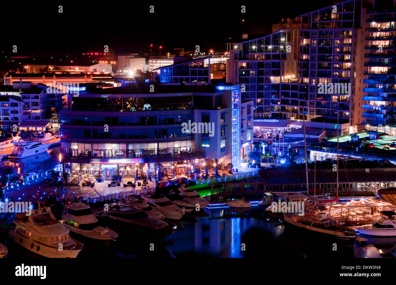 The famous marina in Gibraltar (Ocean Village) at night Stock Photo - Alamy