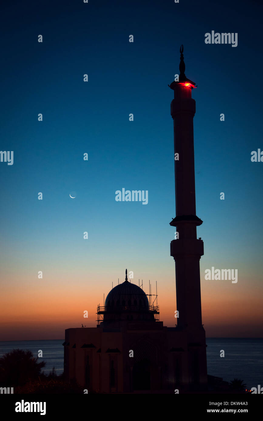 The famous mosque in Gibraltar at dawn with a crescent moon in the ...