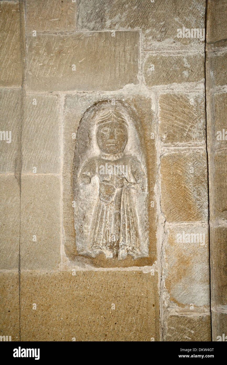 Medieval Pilgrim figure stone carving inside the church at Youlgreave ...
