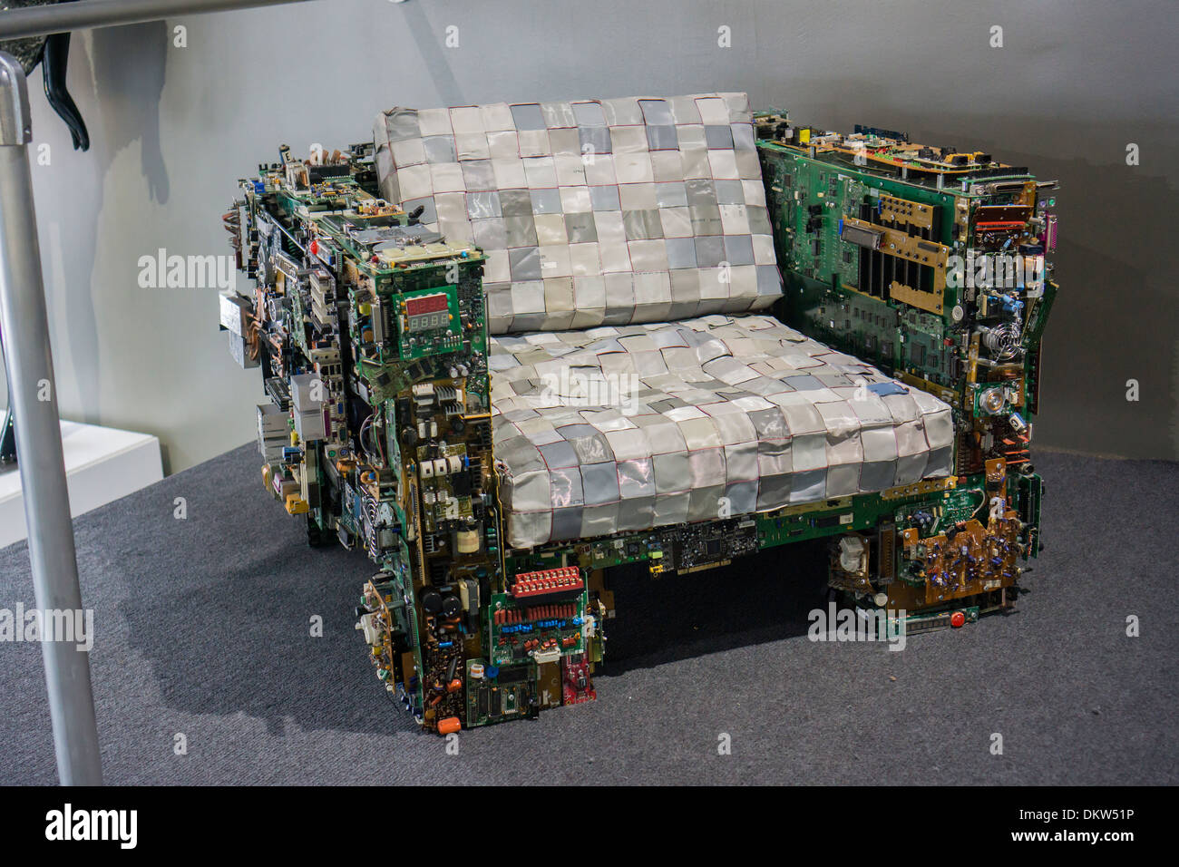 Various circuit boards and other computer parts are collaged in "Binary ...