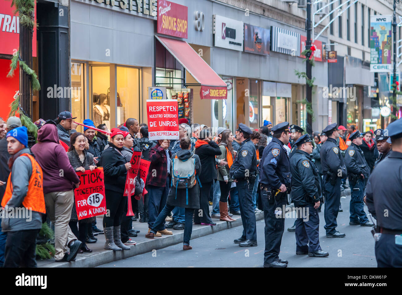Workers at fast food restaurants and their supporters protest in front ...