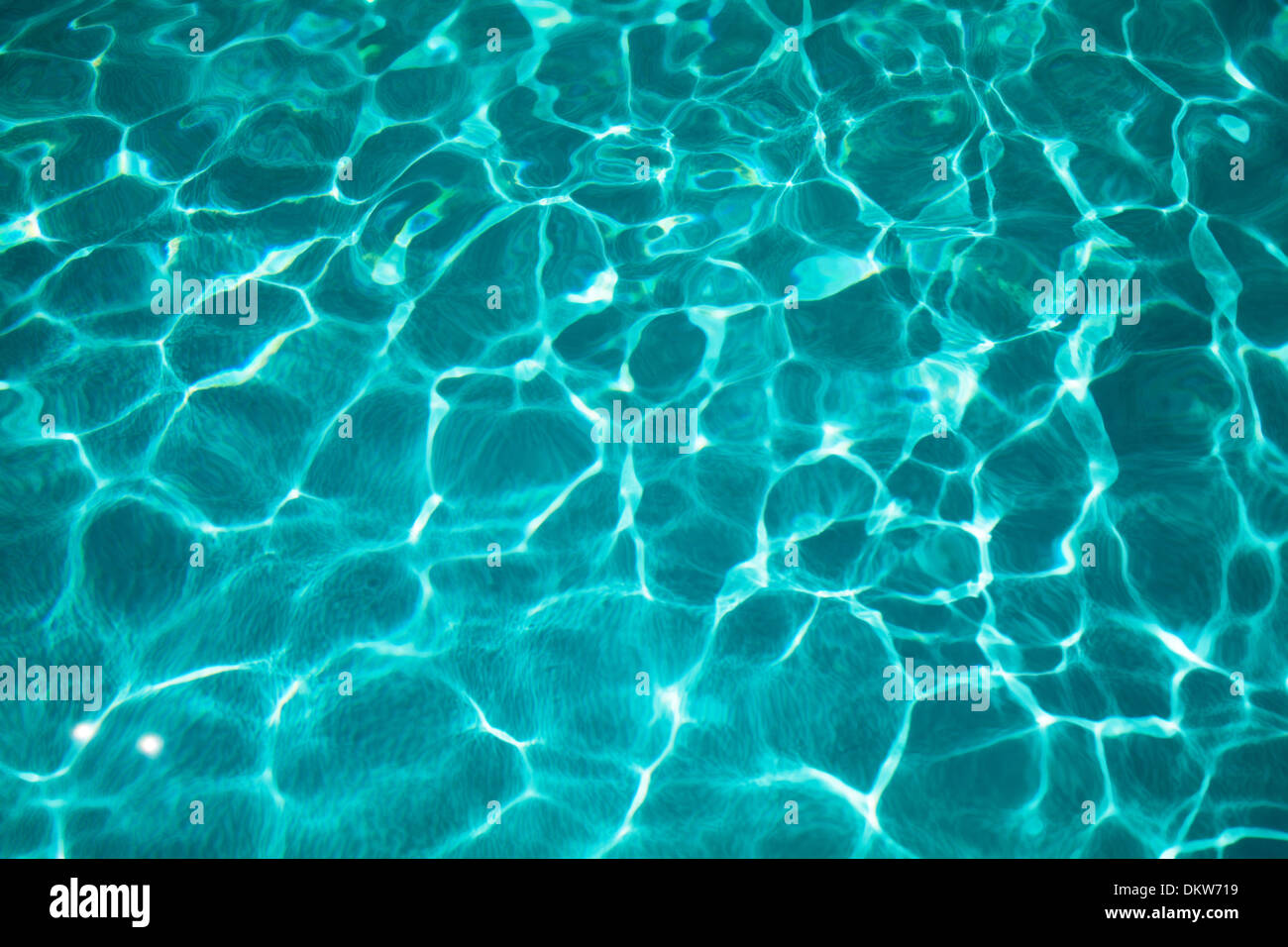 Blue ripped water in swimming pool with sun reflections Stock Photo - Alamy