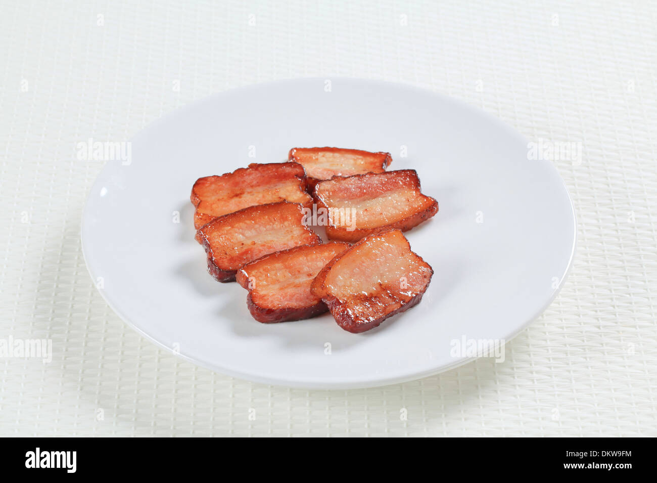 Pan fried pieces of salt pork Stock Photo - Alamy