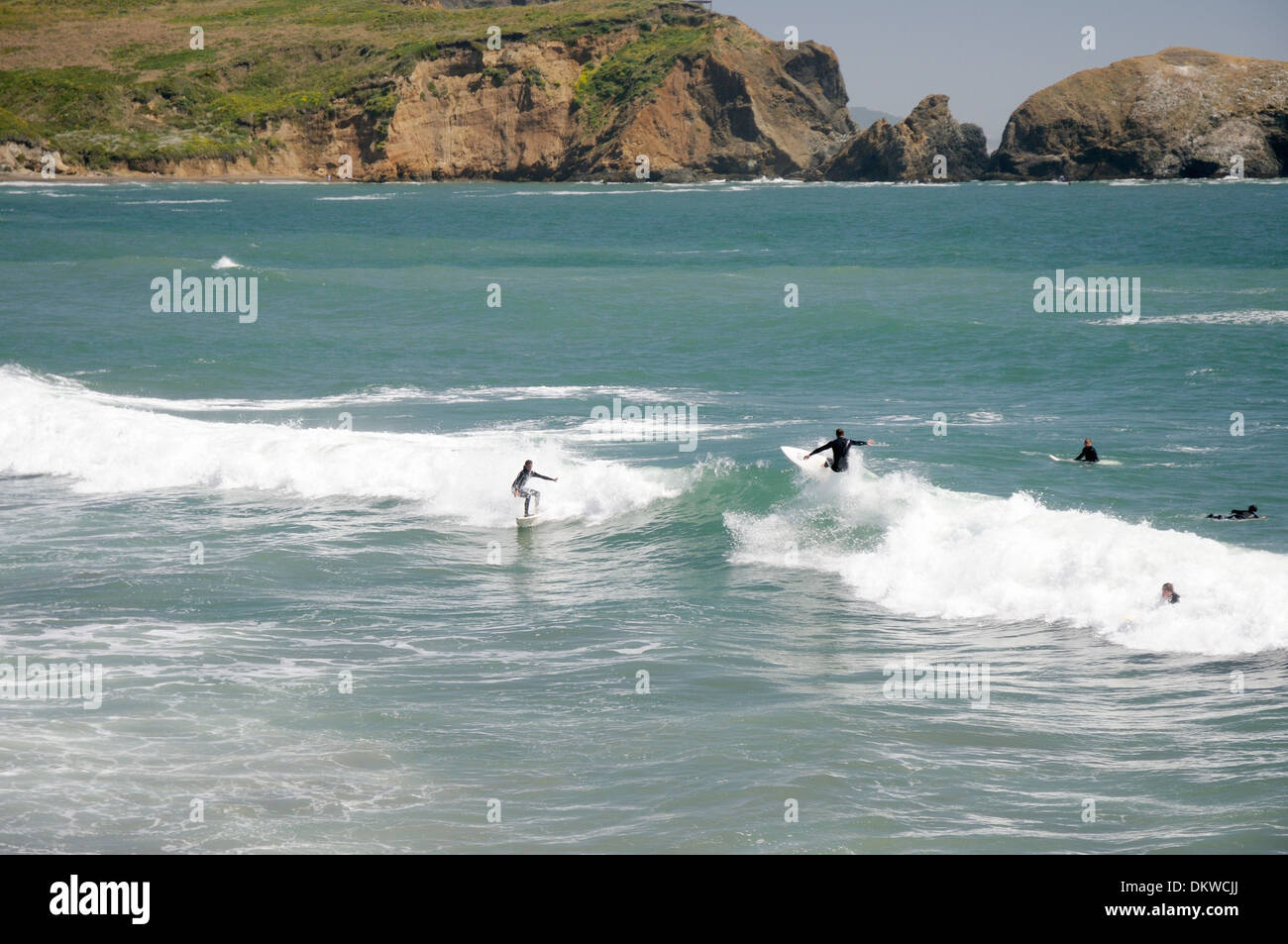 Surfers at Rodeo Beach at Golden Gate National Recreation Area near San ...