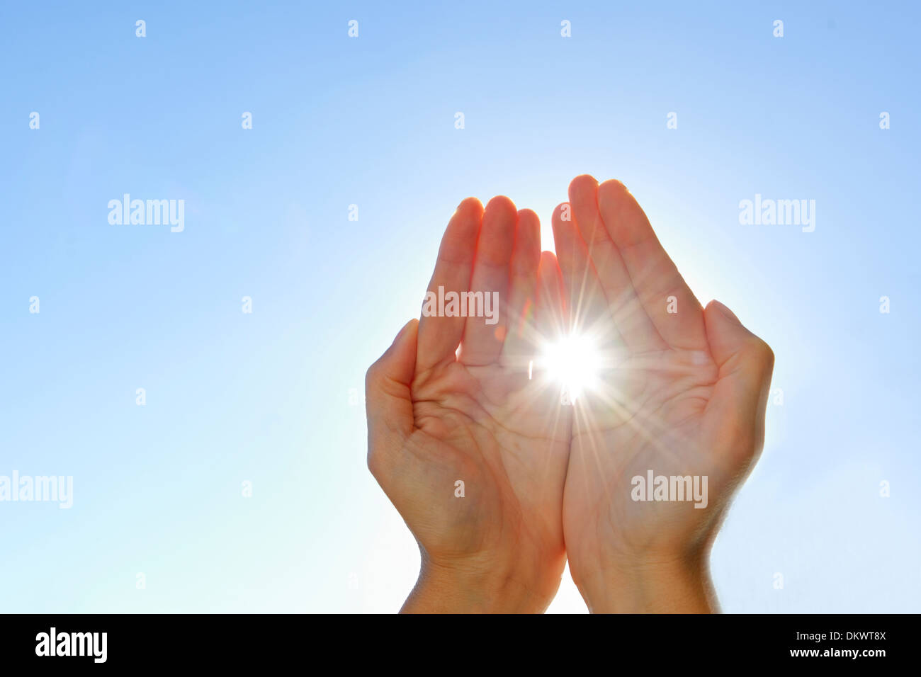 Hands catching light, sun Stock Photo - Alamy