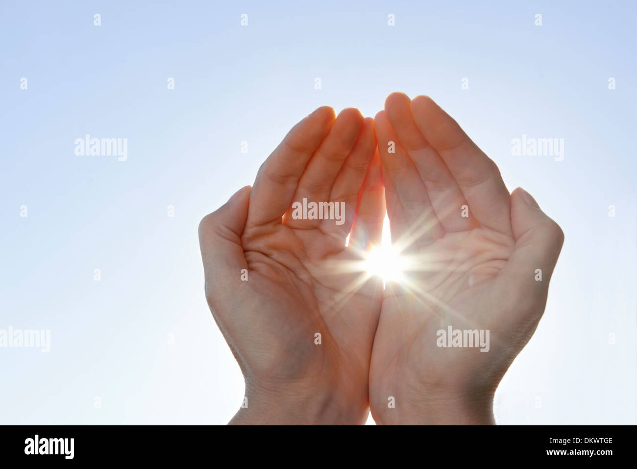 Hands catching light, sun Stock Photo - Alamy