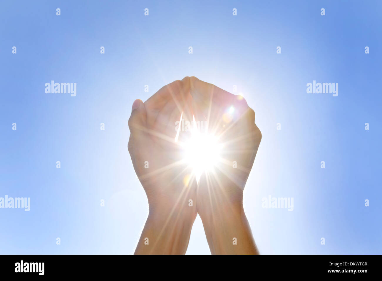 Hands catching light, sun Stock Photo - Alamy
