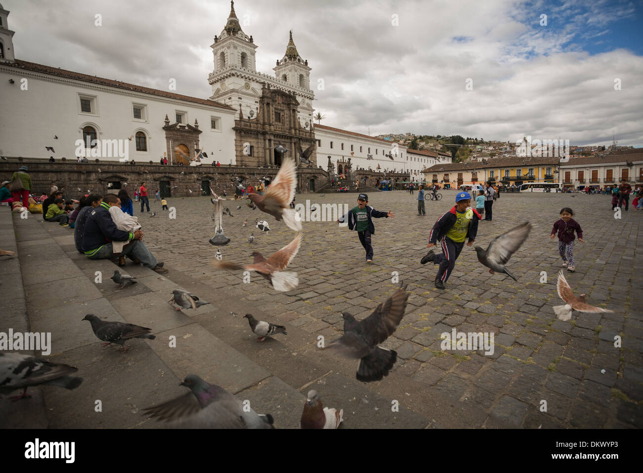 Children chase pigeons in the Plaza Grande - Quito, Ecuador Stock Photo ...