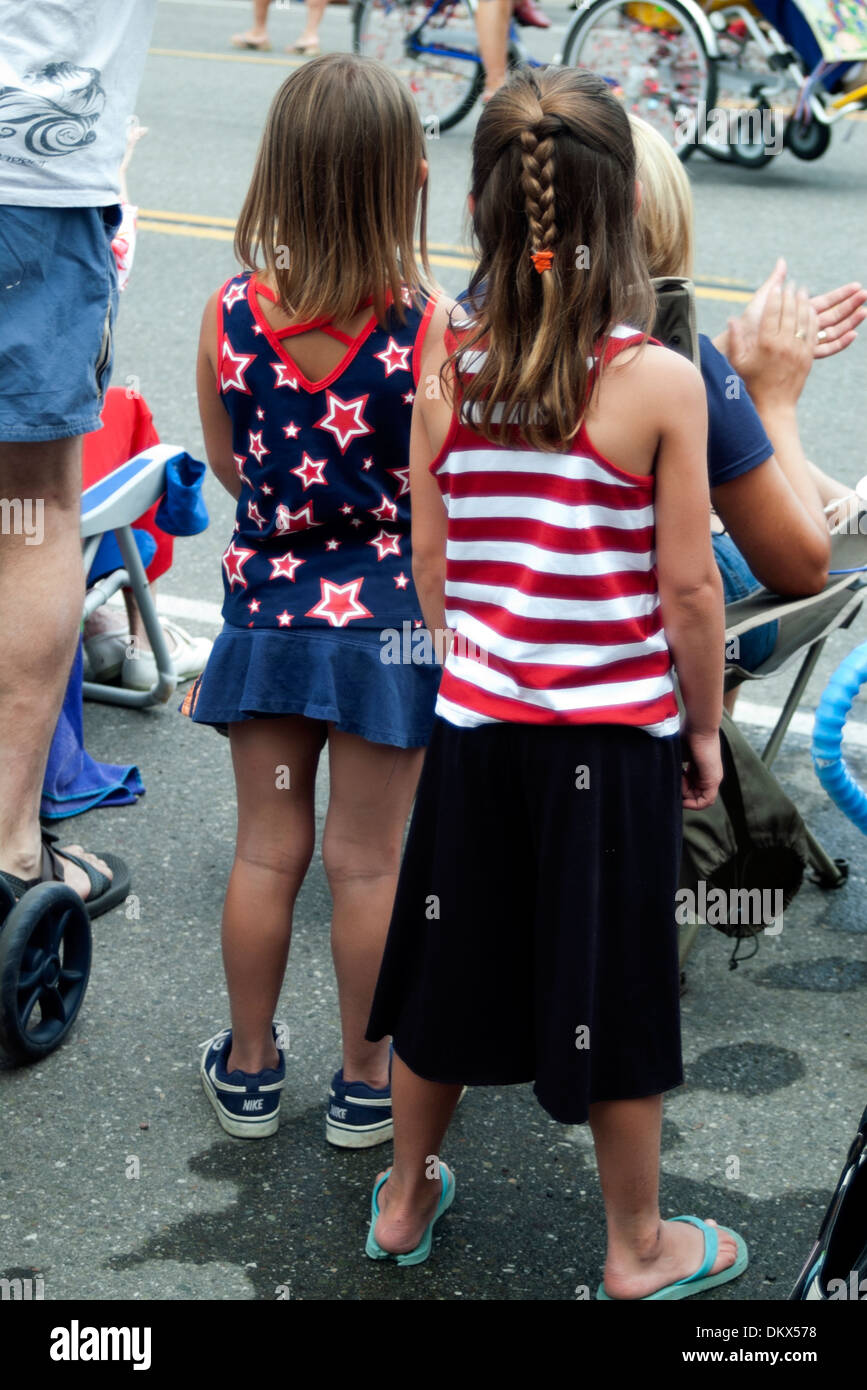 Fourth of July Parade, small town, the backs of two little girls ...