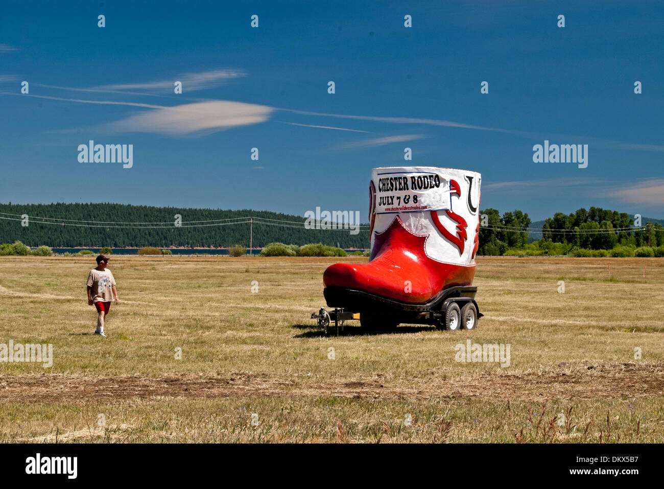 Man walks by enormous boot advertising Rodeo Stock Photo - Alamy