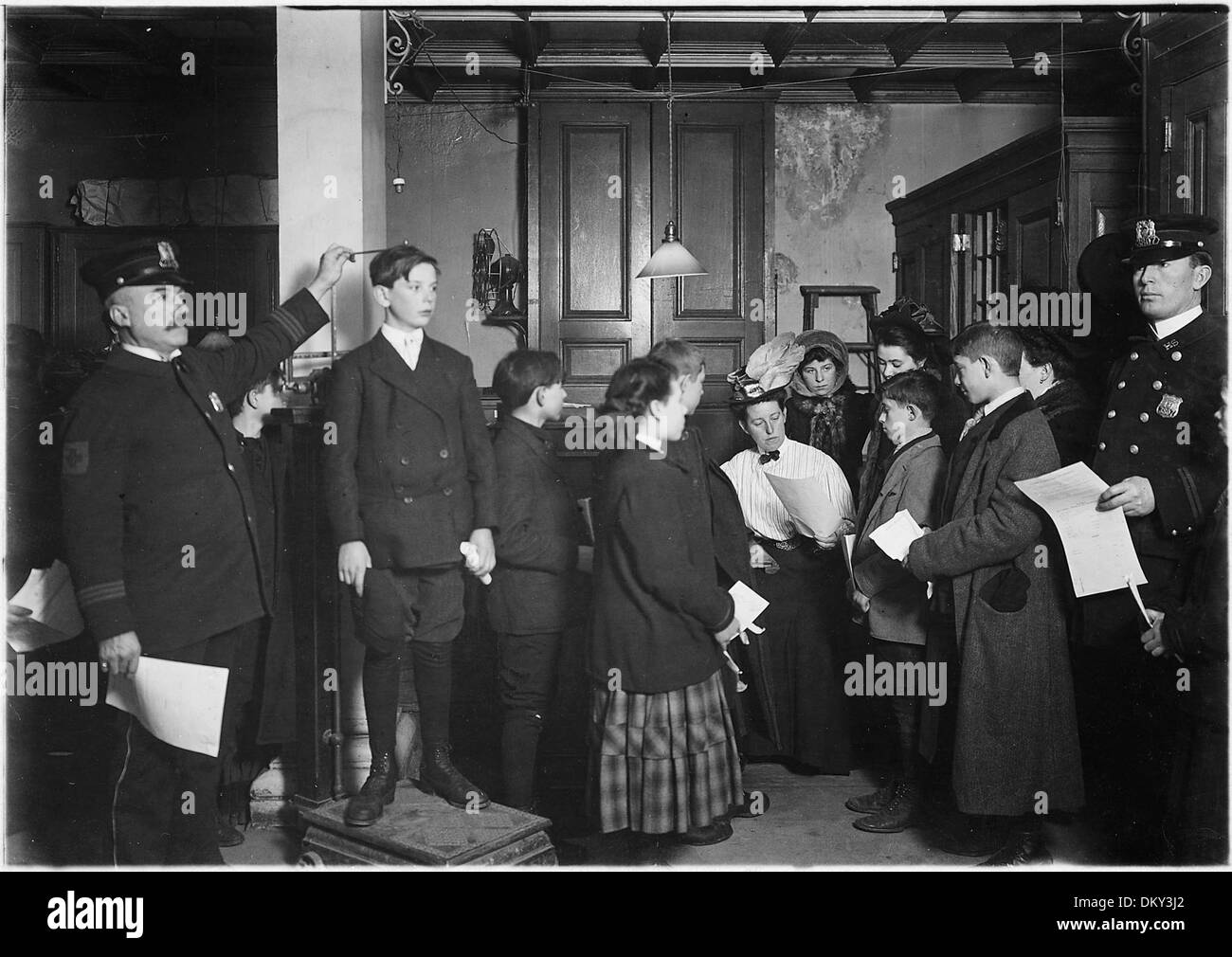 This photograph shows individuals in New York obtaining their working ...