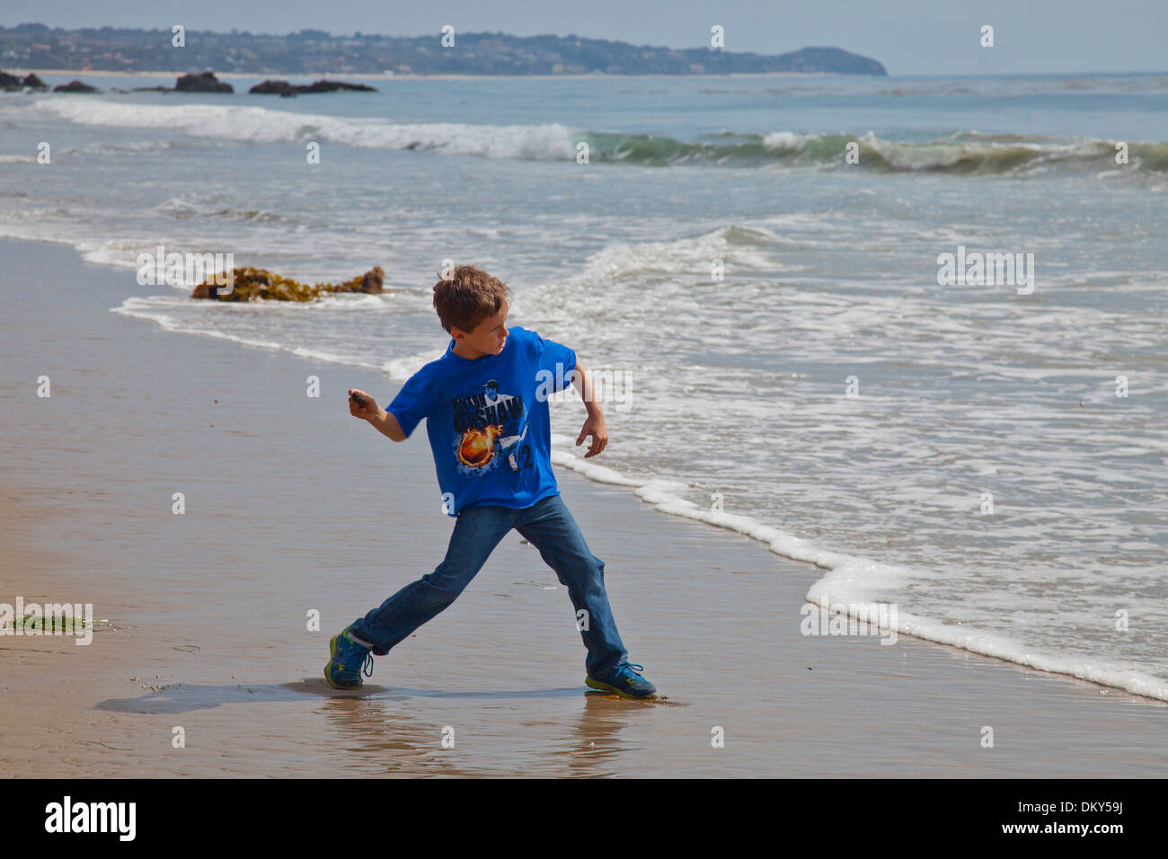 Boy throwing rocks hi-res stock photography and images - Alamy