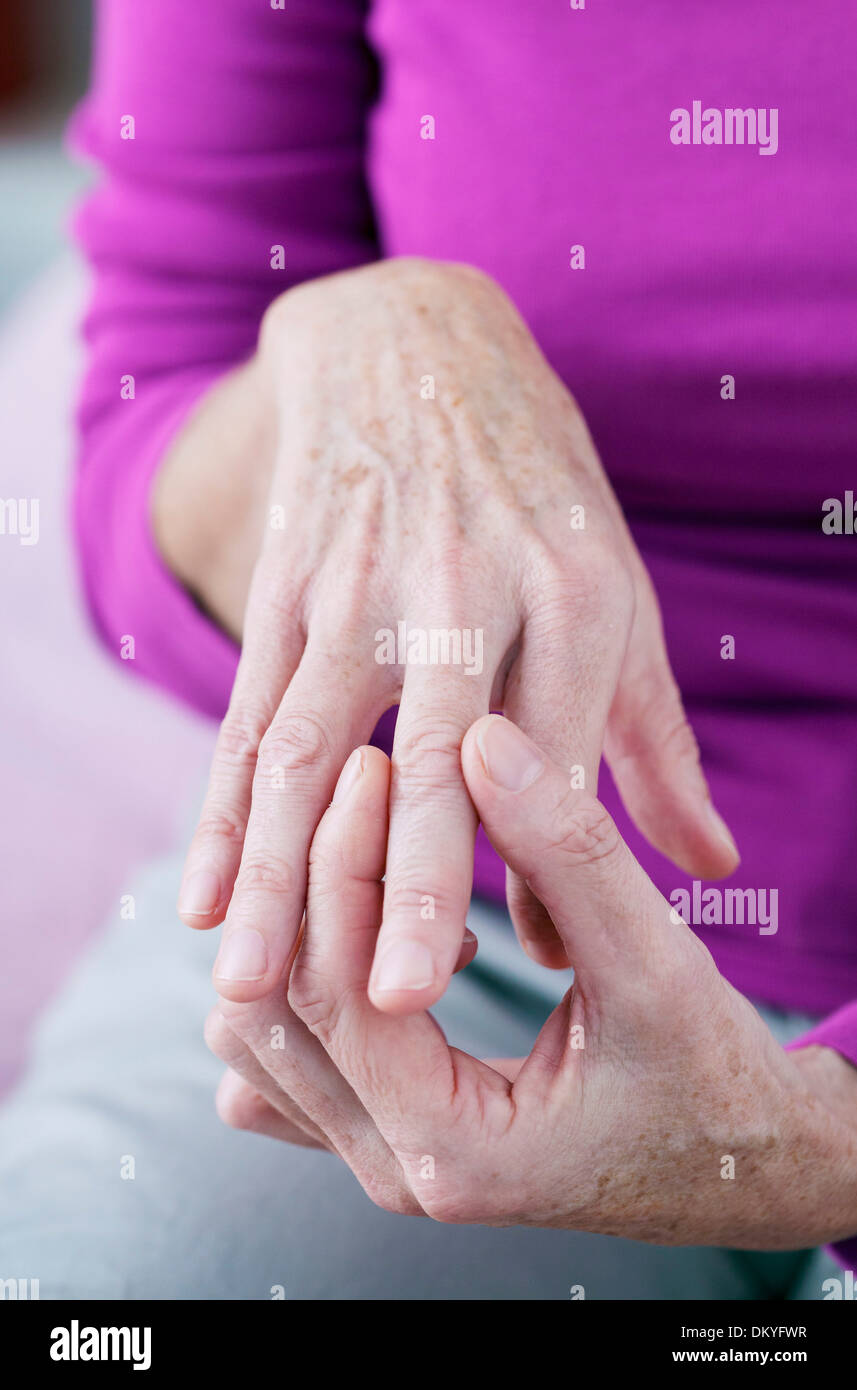 ELDERLY PERSON WITH PAINFUL HAND Stock Photo - Alamy