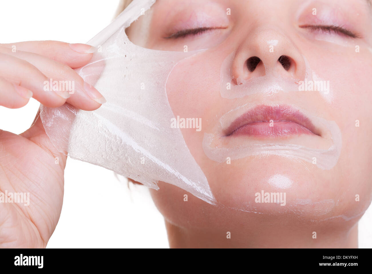 Portrait of blond girl young woman in facial peel off mask. Peeling ...