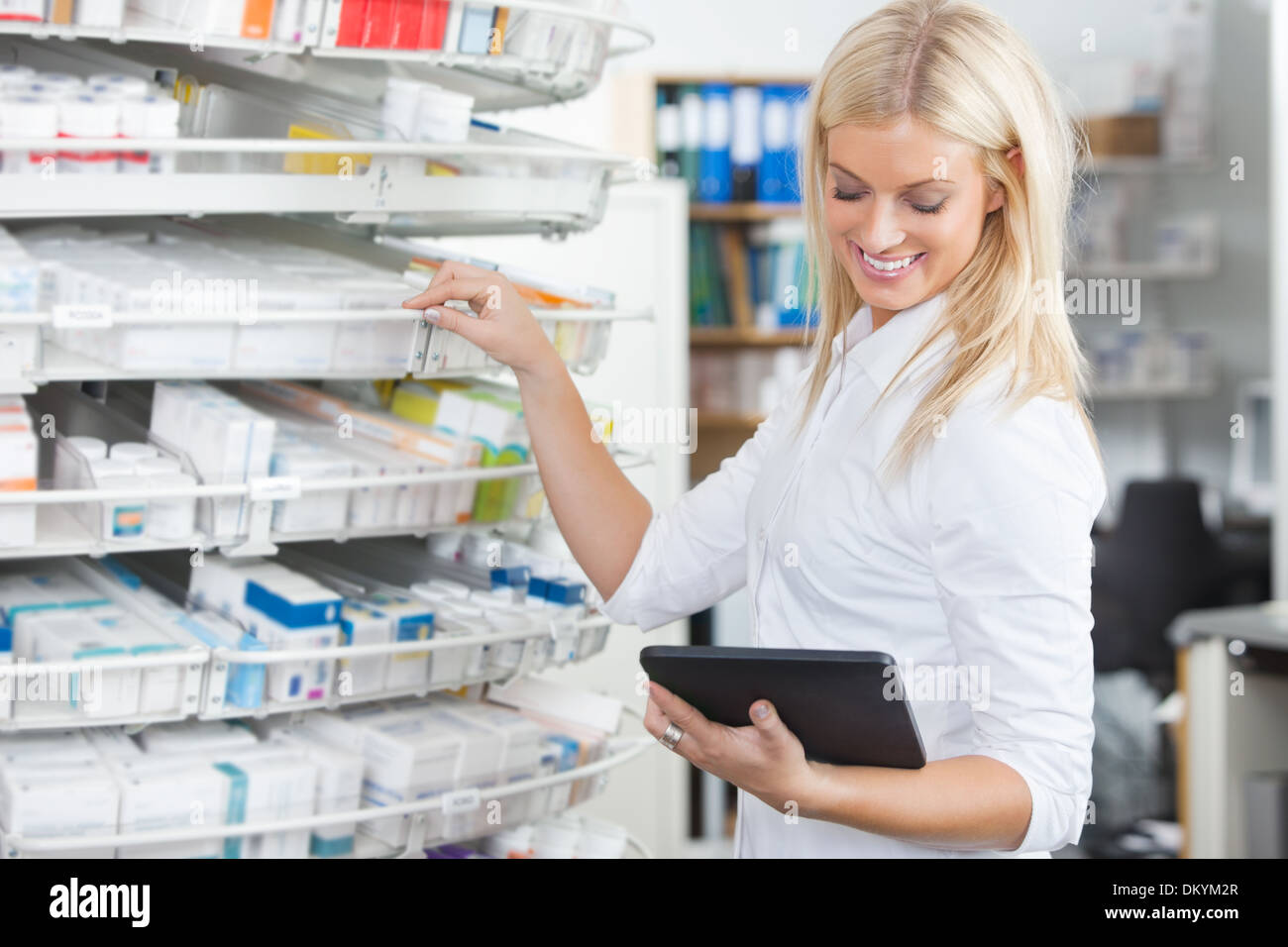 Female Chemist Standing in Pharmacy Drugstore Stock Photo - Alamy
