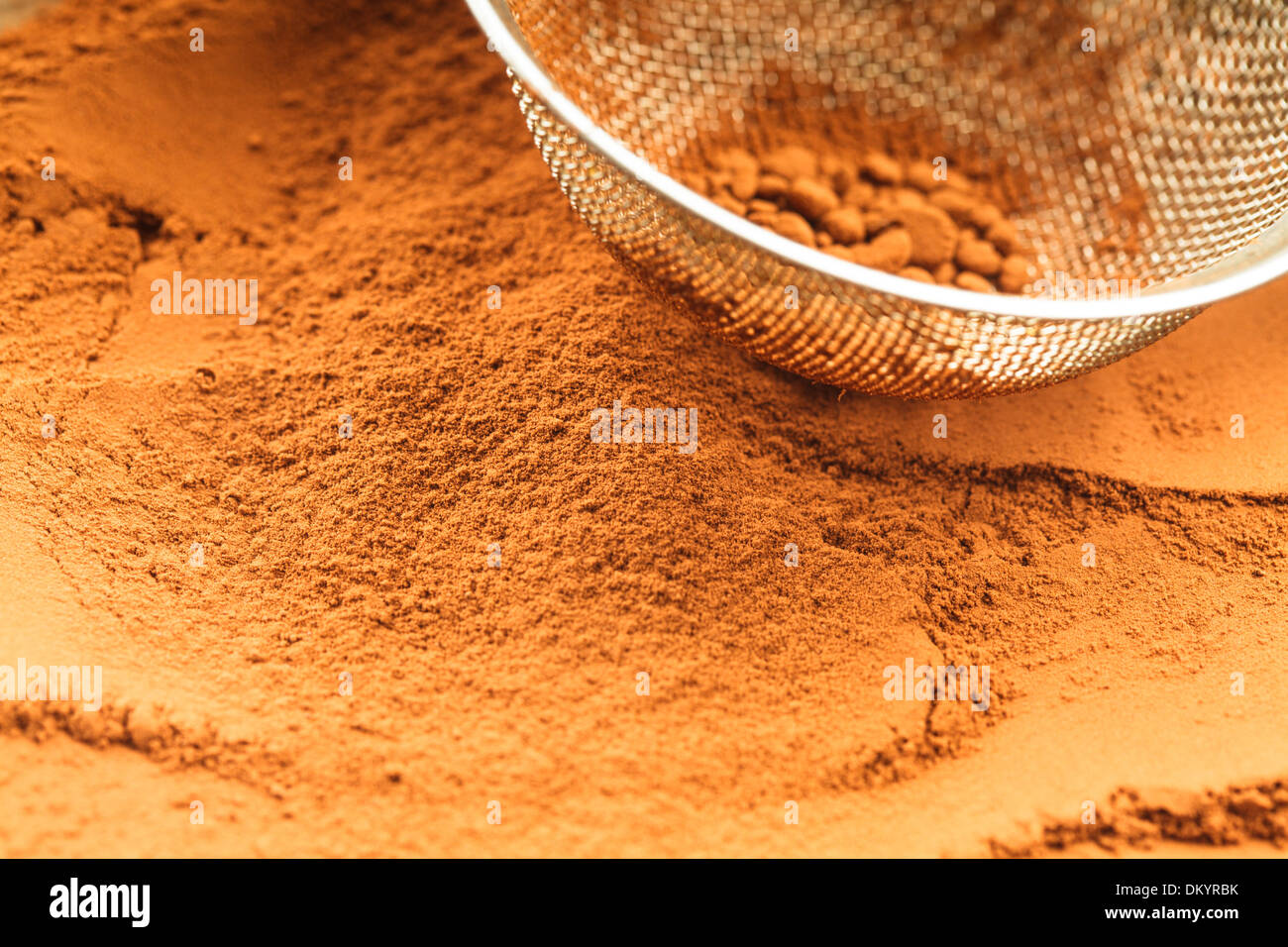 chocolate powder and sieve, prepared for cooking Stock Photo - Alamy