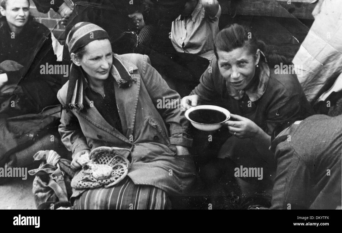 Street scene in Berlin at the end of the war in 1945 - a thin woman ...