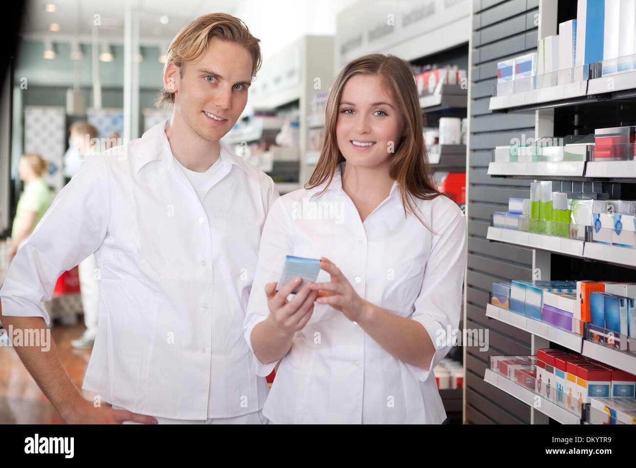 Two young professional consulting other hi-res stock photography and ...