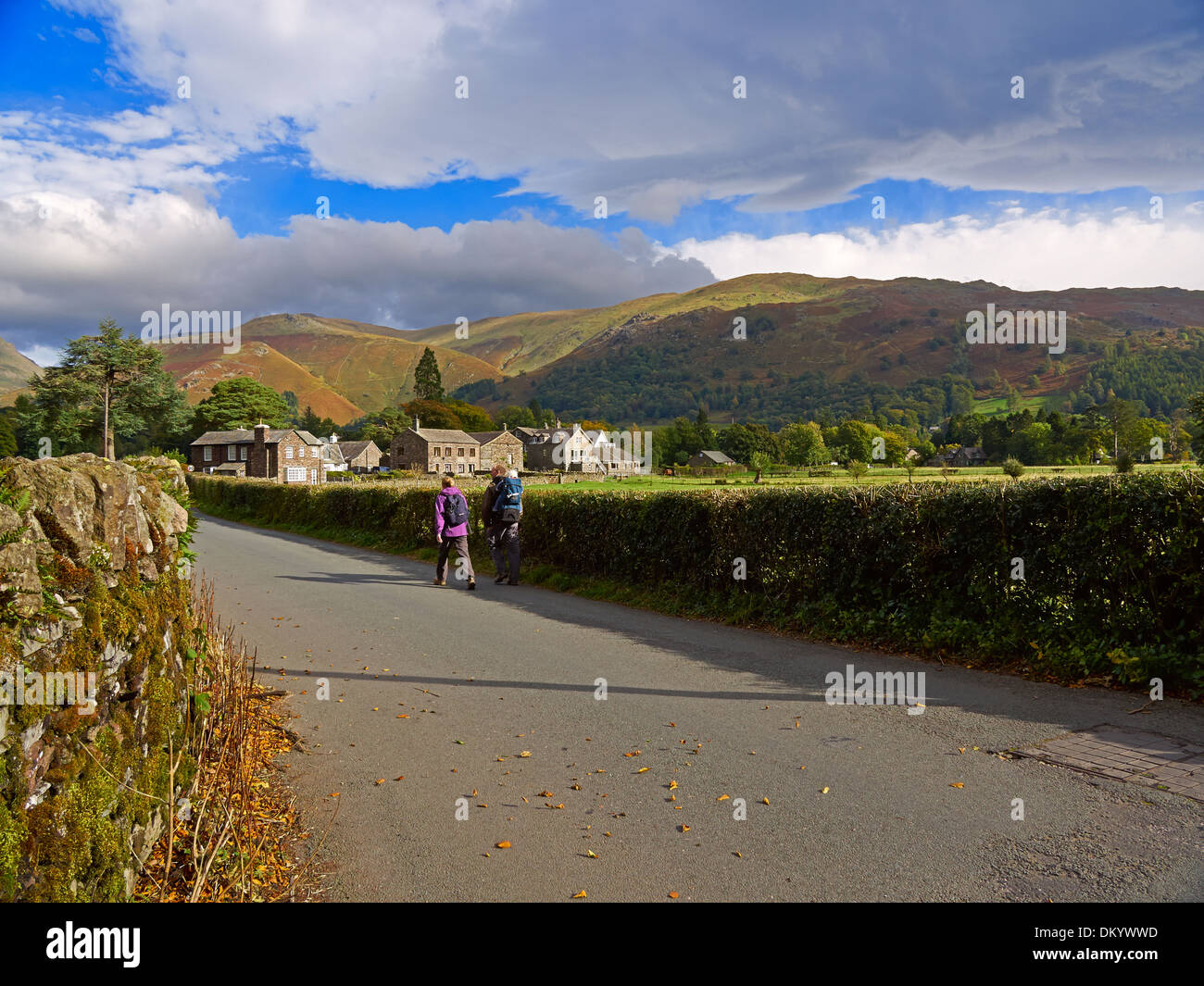 Walkers on the Broadgate road going into Grasmere. The man is walking ...