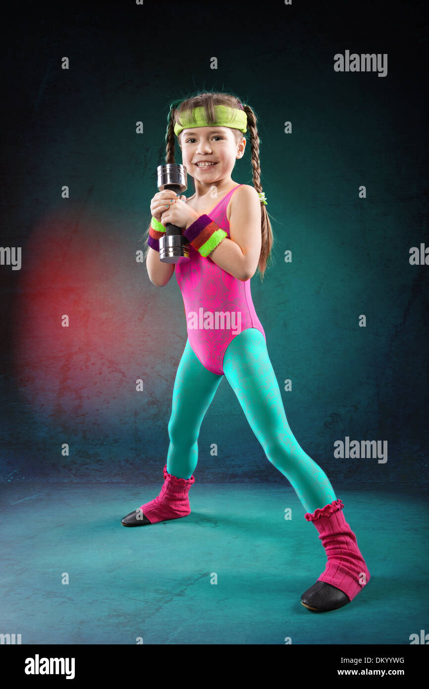 Little girl with barbells at fitness exercise Stock Photo - Alamy