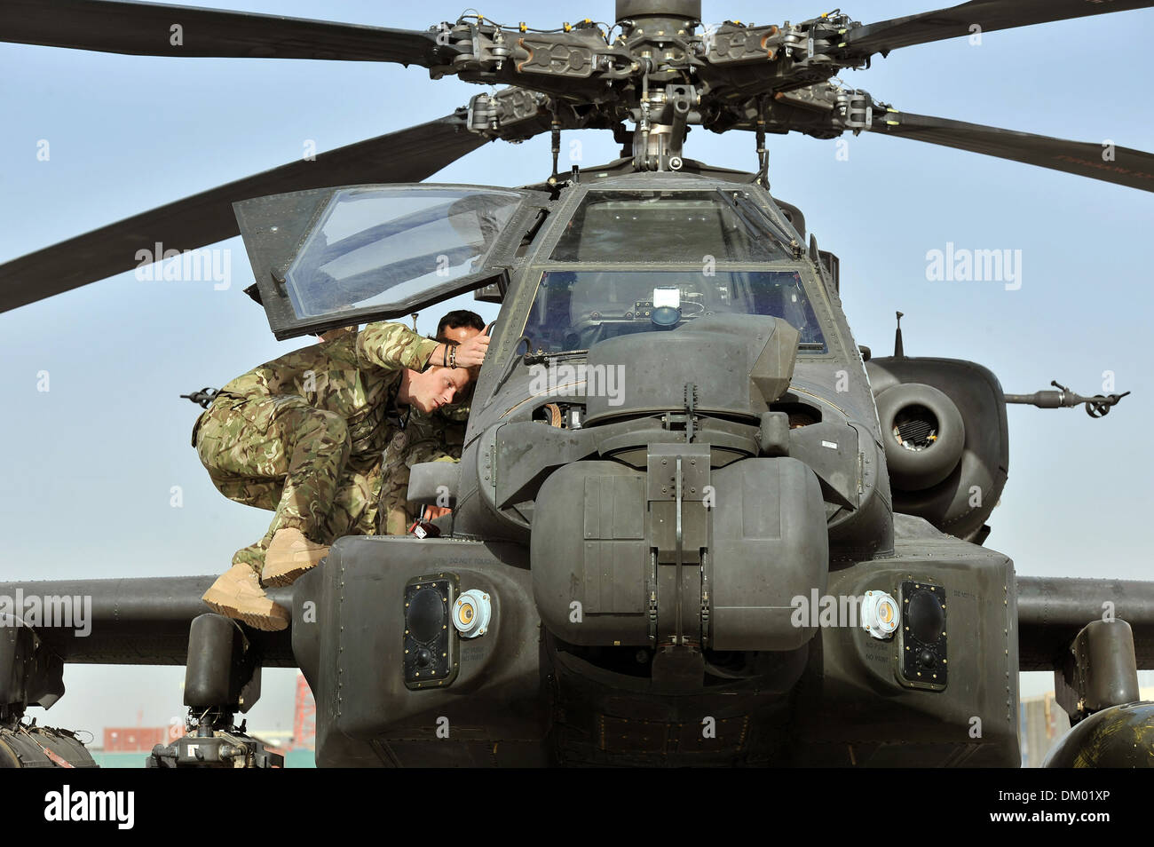 Prince Harry is shown Apache flight-line by a member of his squadron ...