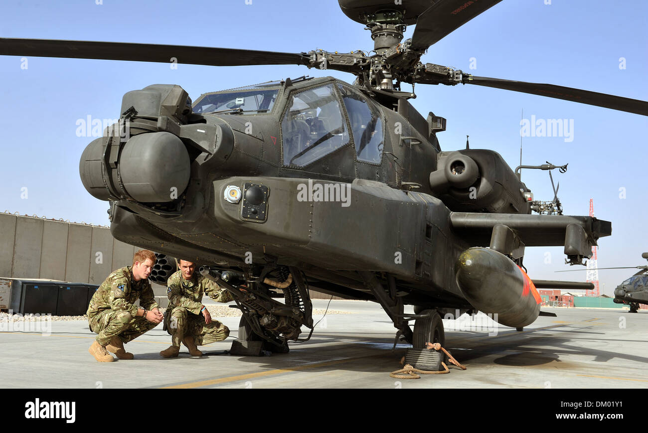 Prince Harry is shown Apache flight-line by a member of his squadron ...