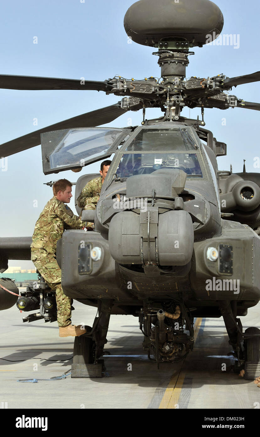Prince Harry is shown Apache flight-line by a member of his squadron ...