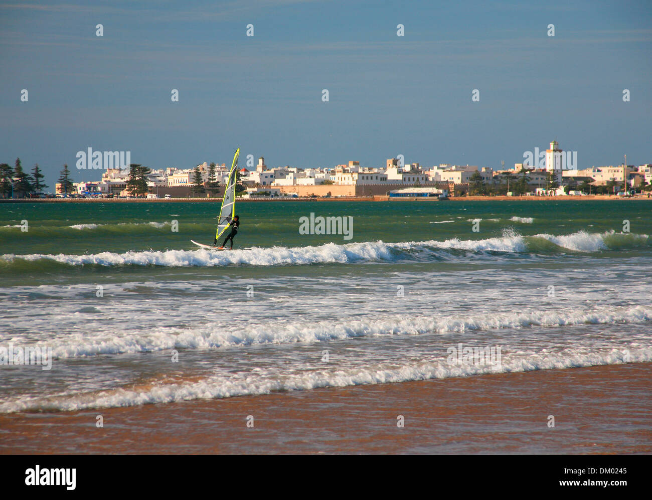 Essaouira beach and town with windsurfer in the waves Stock Photo - Alamy