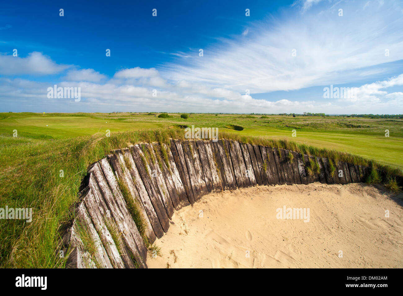 Golf course bunker with steep railway sleeper face Stock Photo - Alamy