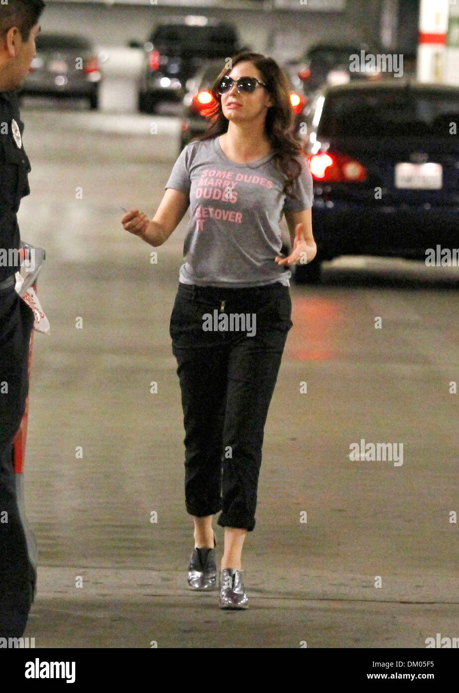 Rose McGowan wearing a t-shirt with pink writing stating 'Some Dudes ...