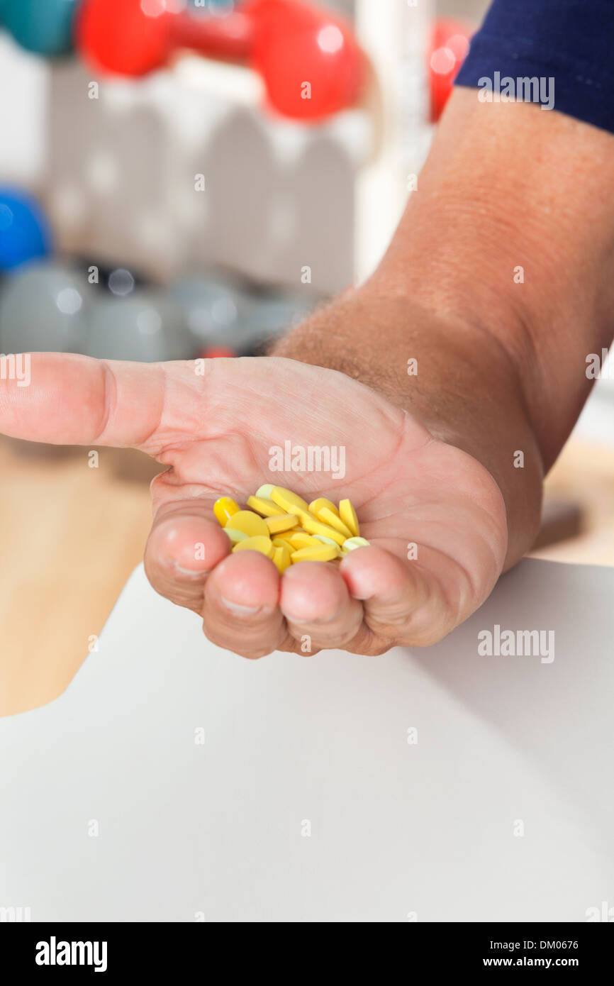 Man holding supplement vertical hi-res stock photography and images - Alamy