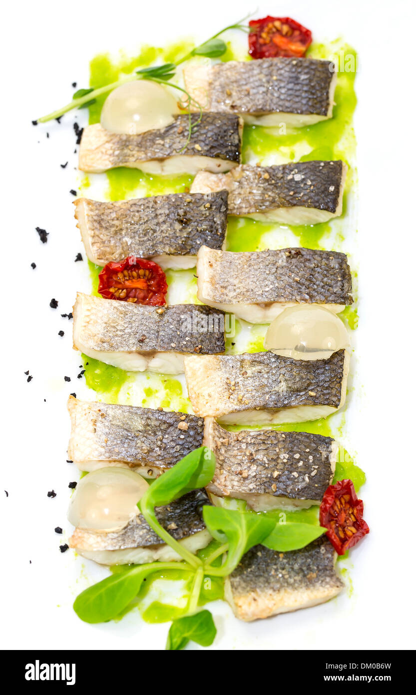 Baked black cod fish on a white background Stock Photo - Alamy